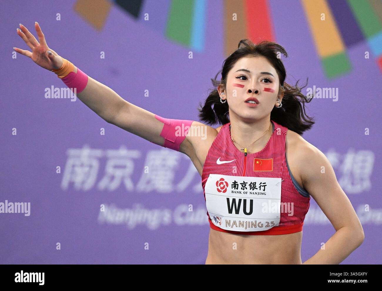 (250323) -- NANJING, March 23, 2025 (Xinhua) -- Wu Yanni of China reacts during the women's 60m ...