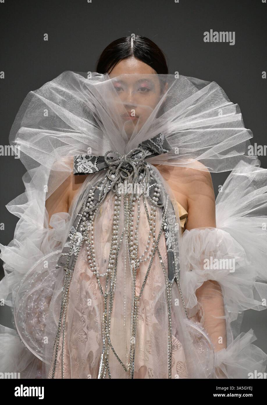 Beijing, China. 23rd Mar, 2025. A model presents a creation of Bronze ...