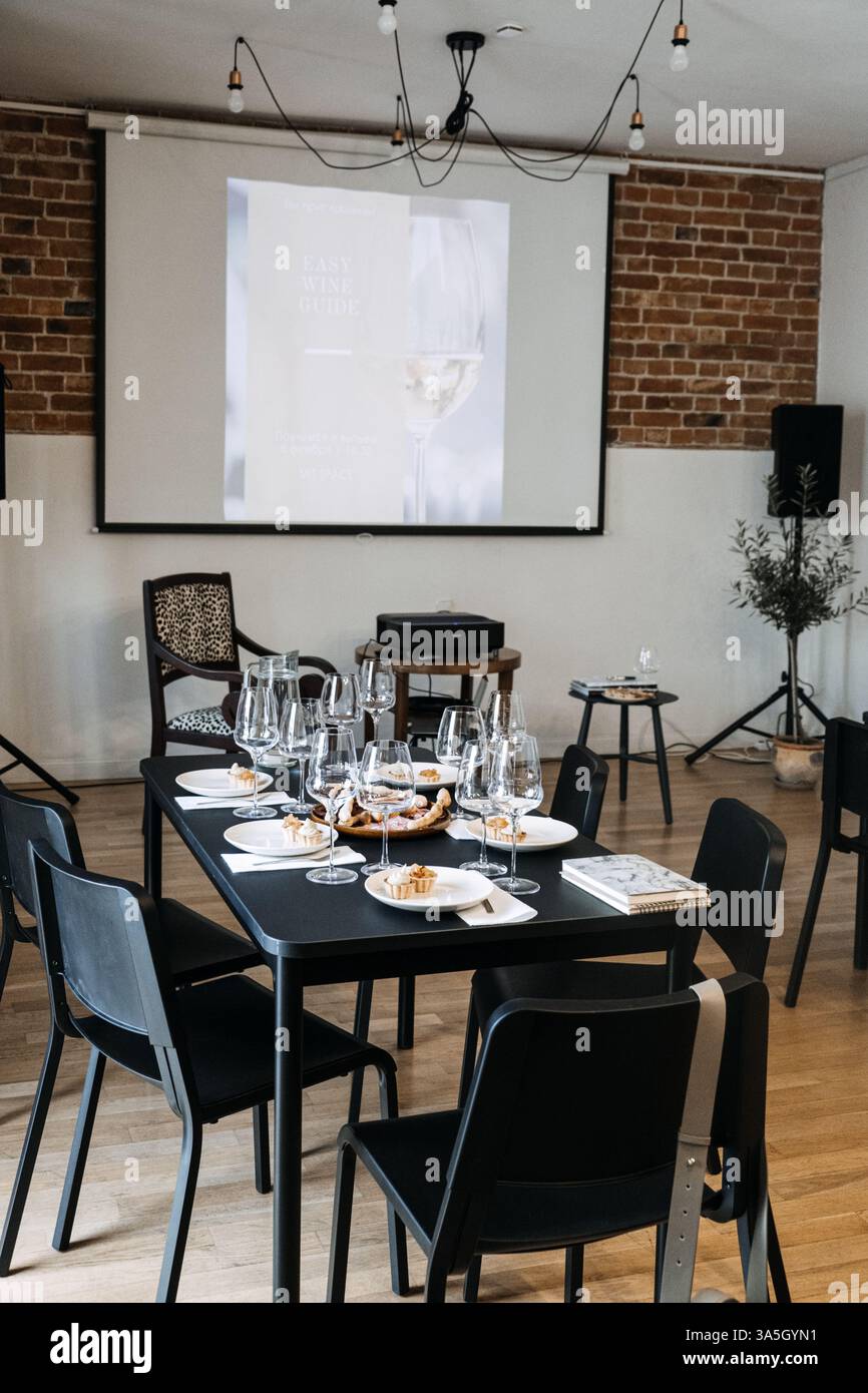 Wine tasting workshop setup in modern industrial-style room with ...