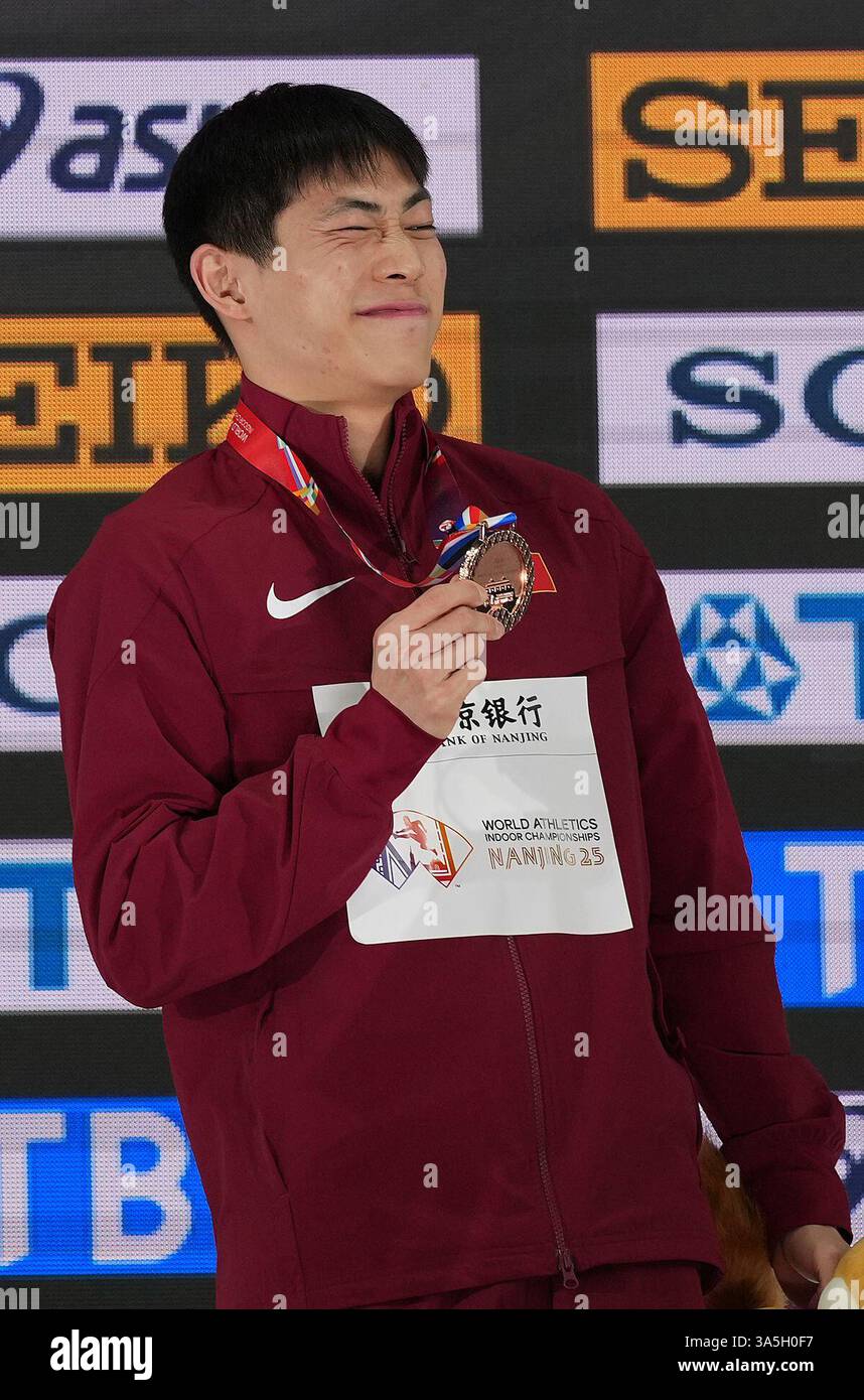 Nanjing, China's Jiangsu Province. 23rd Mar, 2025. Bronze medalist Liu Junxi of China reacts ...