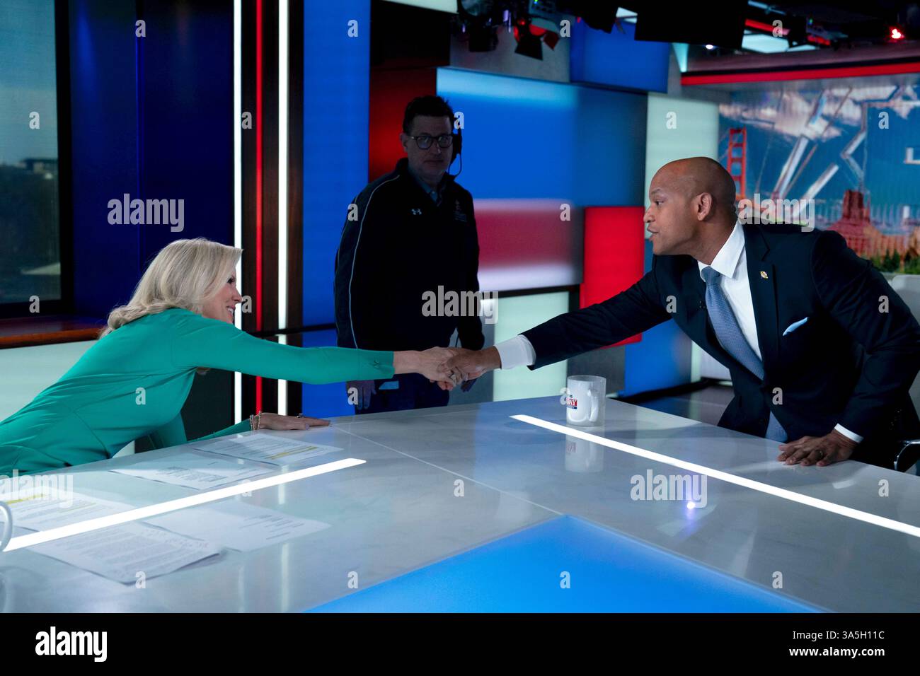 Maryland Gov. Wes Moore, right, shakes the hand of Shannon Bream during ...