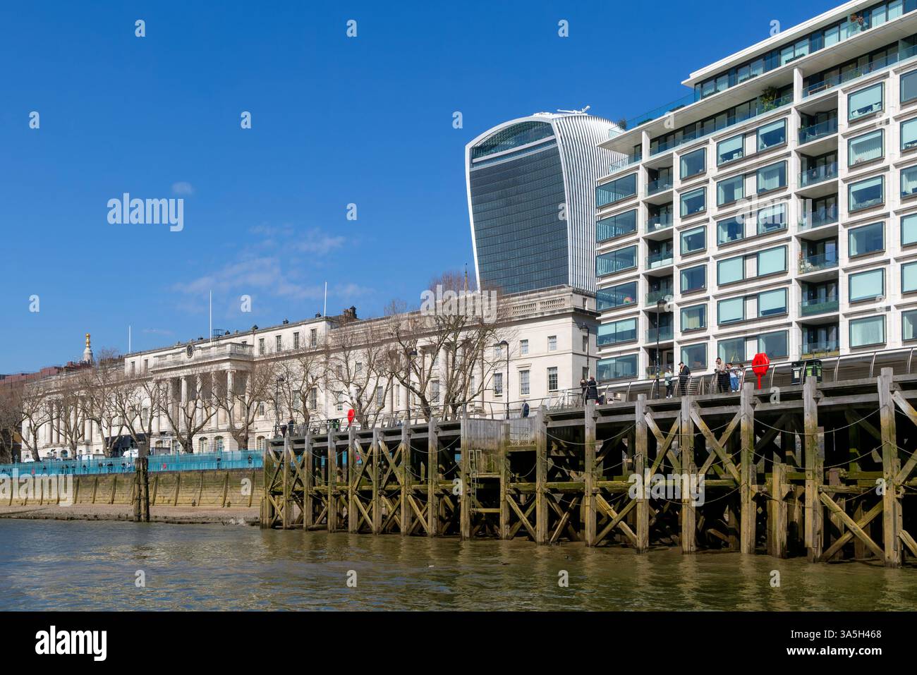 Mix of old and new buildings on River Thames waterfront, Lower Thames ...