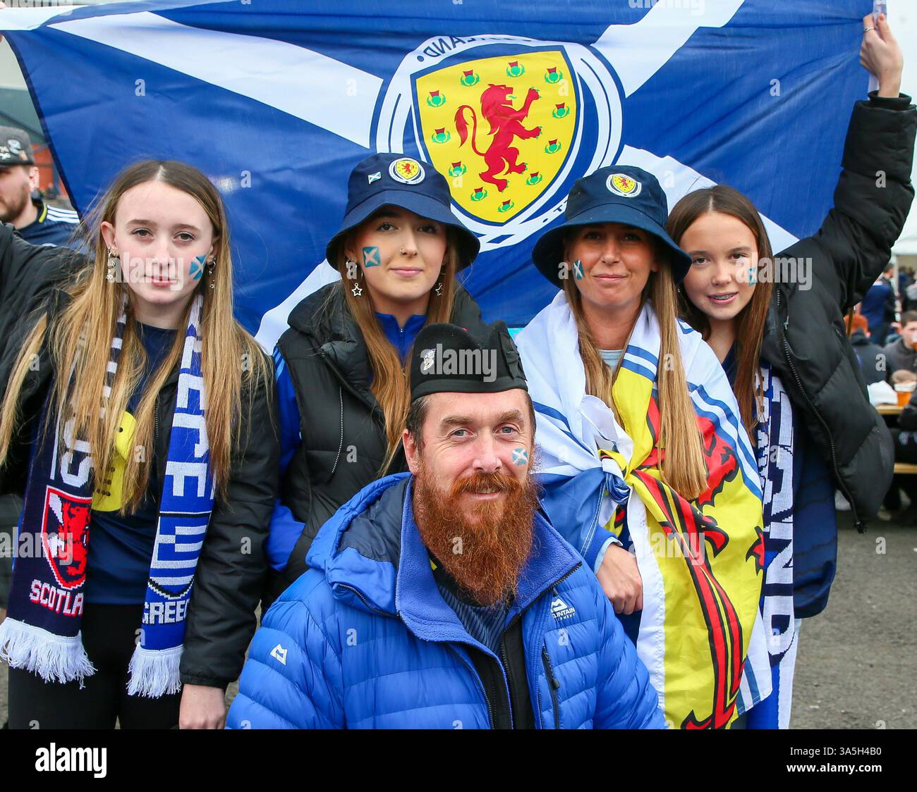 23 March 2025. Glasgow, UK. Scotland and Greece fans arrive at Hampden ...