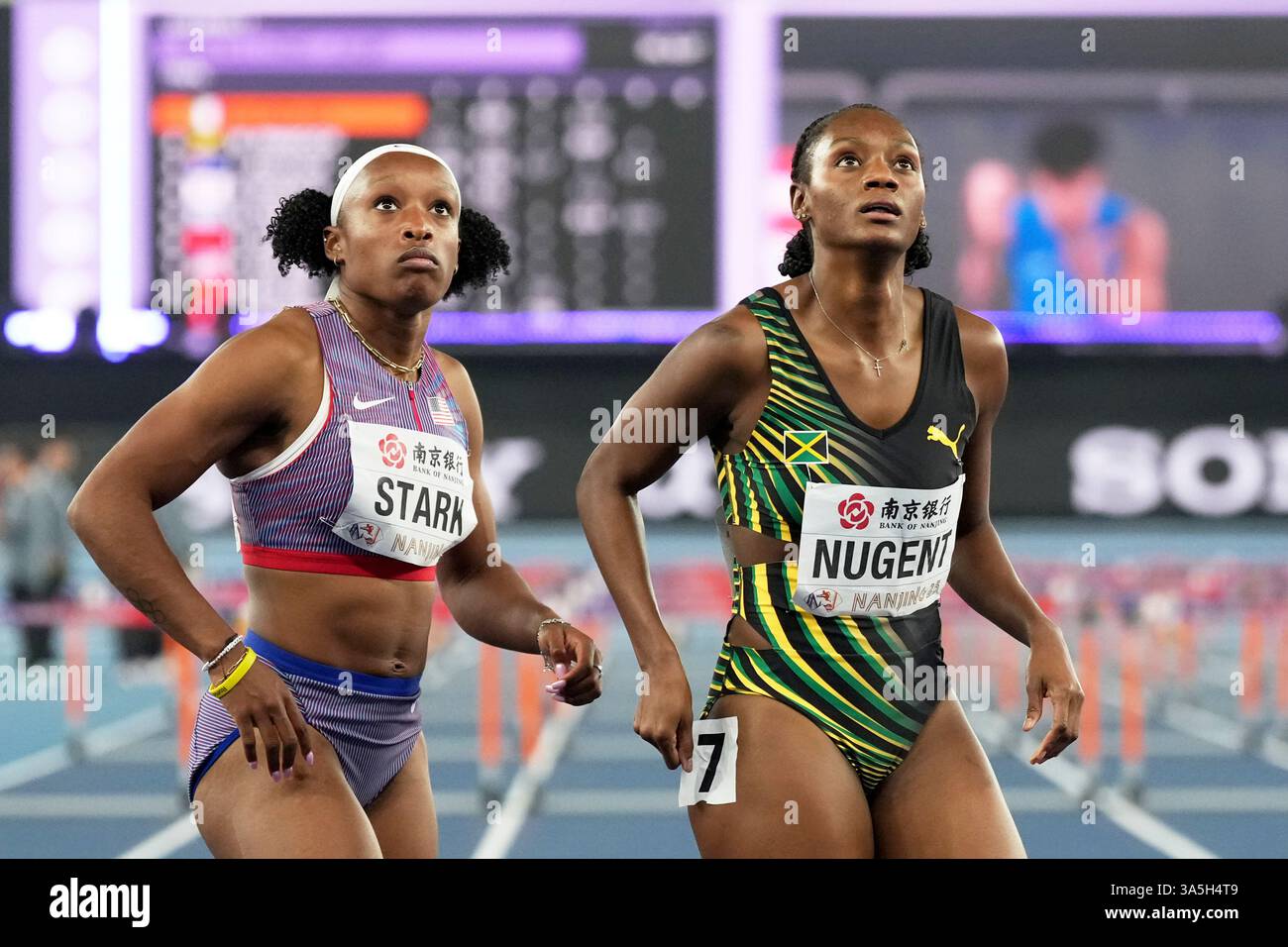 Grace Stark, of the United States, and Ackera Nugent, of Jamaica, look ...