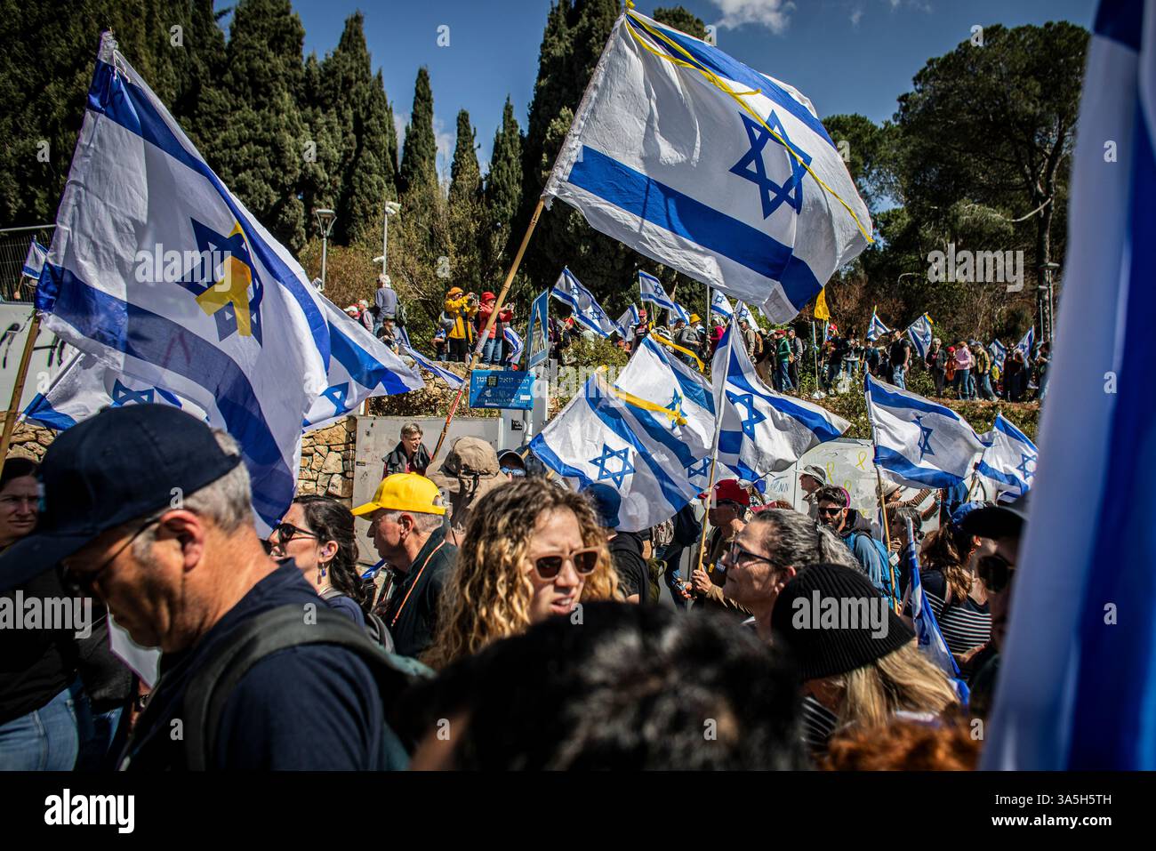 Israeli protestors wave their national flag during a demonstration in ...