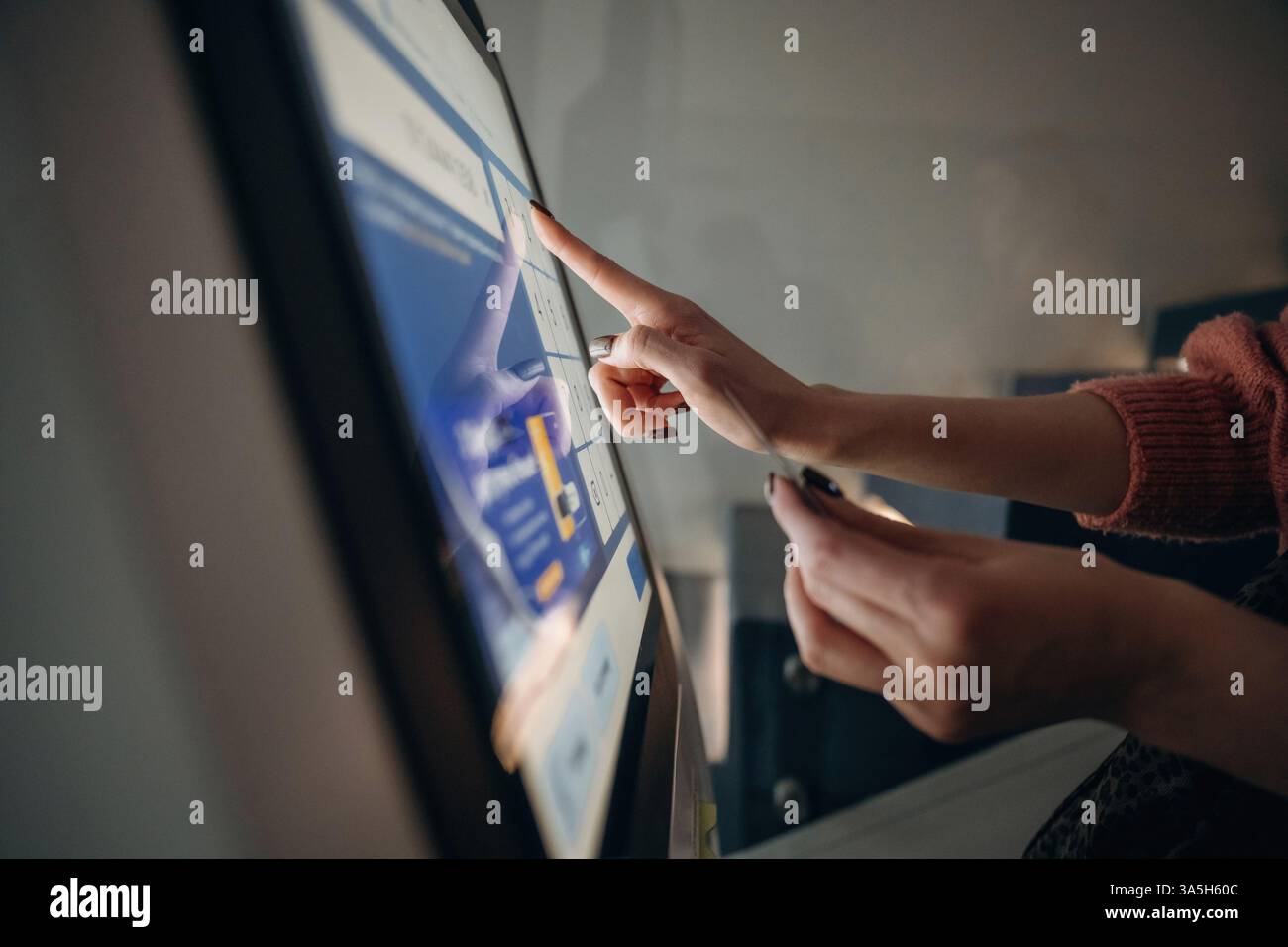 Touch screen, modern technology. Woman is using banking terminal ...