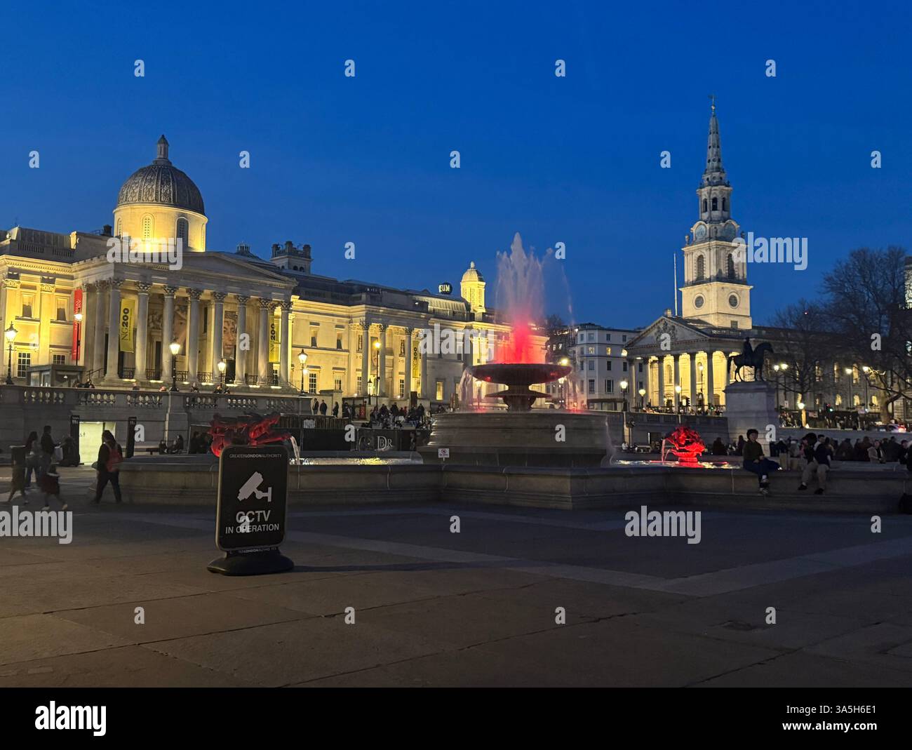 8 March 2025 - London, UK: Trafalgar Square at night with illuminated ...