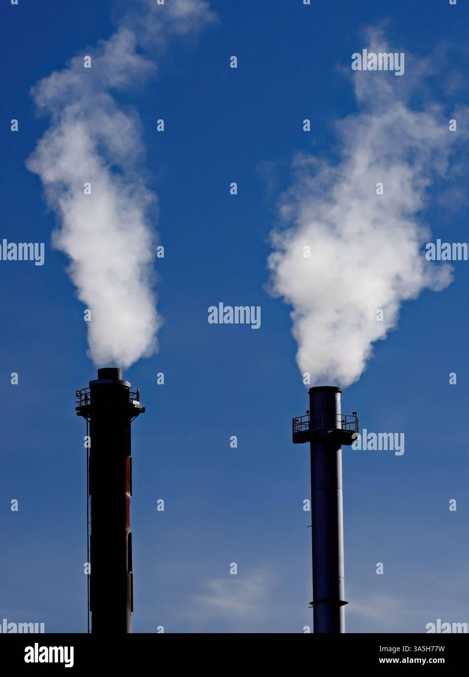 Heating plants pipes bumping steam from the pipes Stock Photo - Alamy