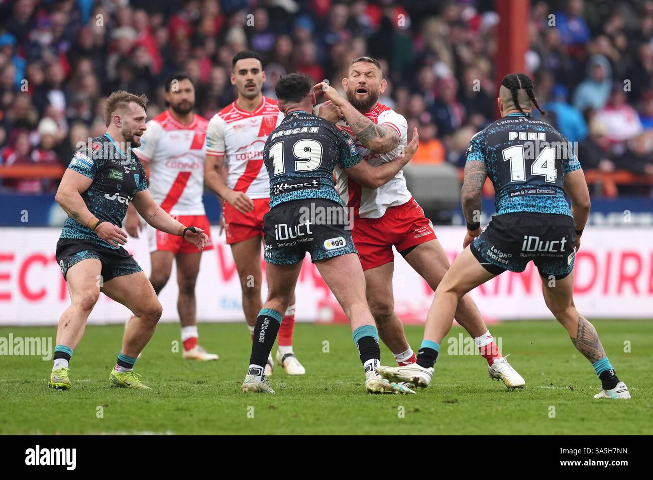 Hull KR's Jared Waerea-Hargreaves is tackled by Leigh Leopards' Louis ...