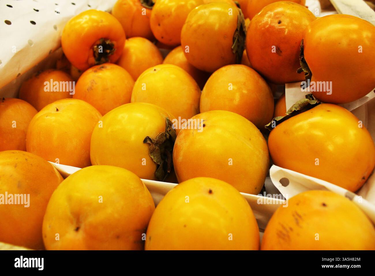 Close-up of yellow persimmons. Yellow Fruit Background Stock Photo - Alamy