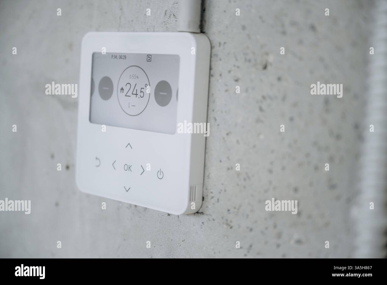 Thermostat on the wall, showing current temperature in the room Stock ...