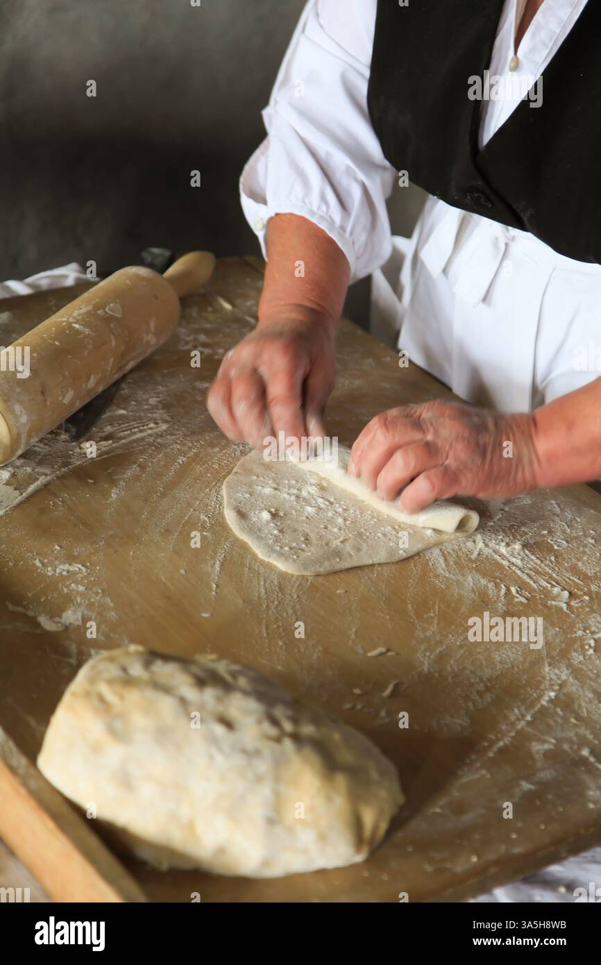 Hands roll rolled out dough together Stock Photo - Alamy