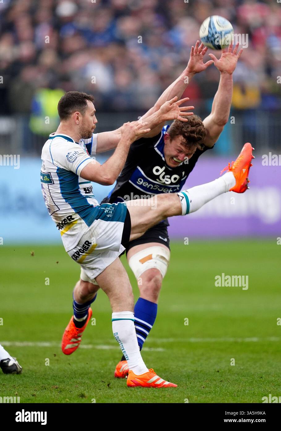 Gloucester's Tomos Williams makes a clearence under pressure from Bath ...