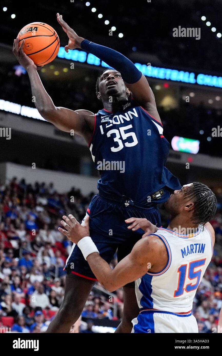 UConn center Samson Johnson shoots over Florida guard Alijah Martin ...