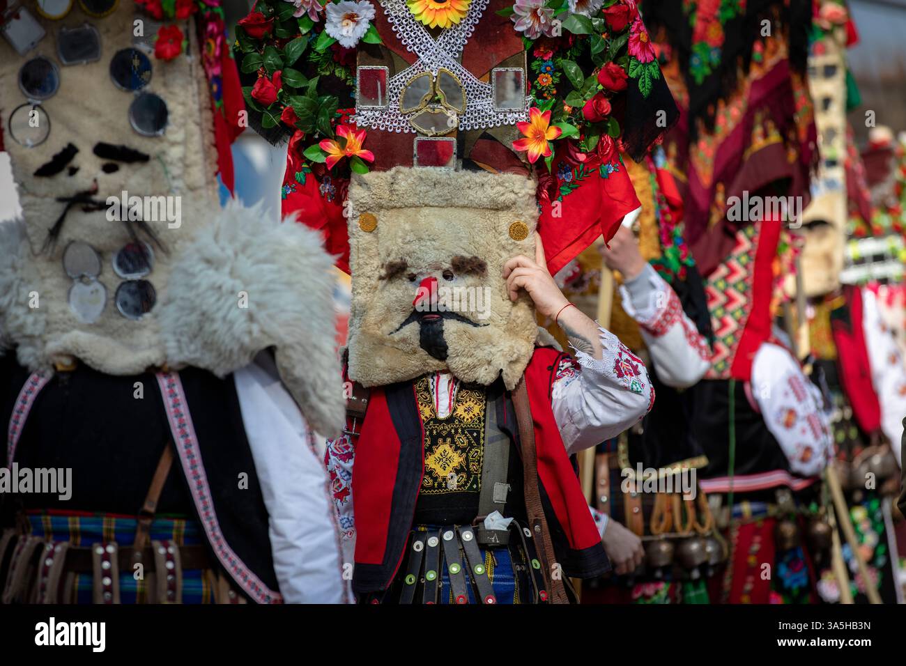 Kyustendil, Bulgaria - February 15, 2025.: Men dressed in traditional Kukeri leather costumes ...