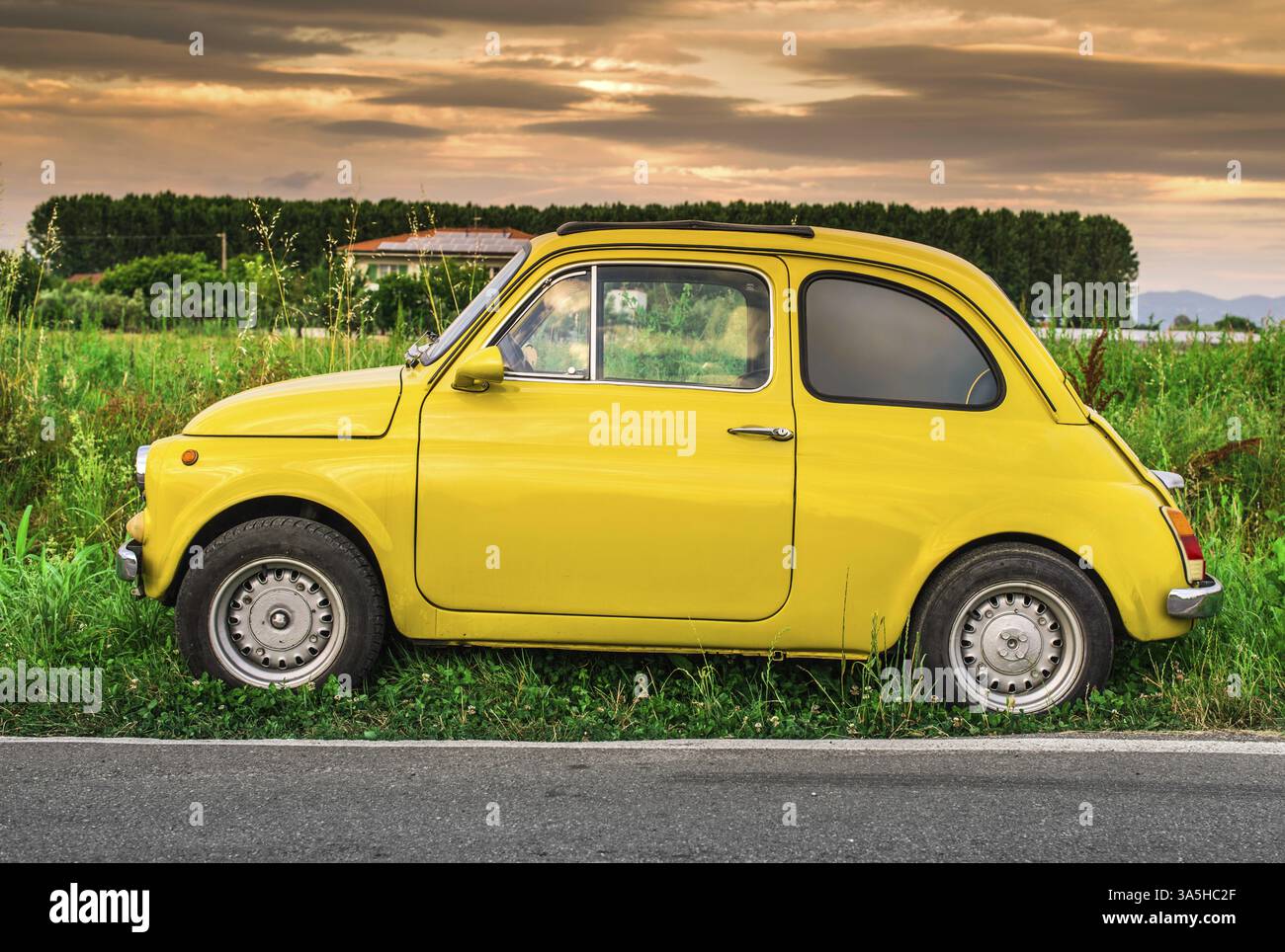 Small vintage italian car Fiat Abarth. Yellow color Stock Photo - Alamy
