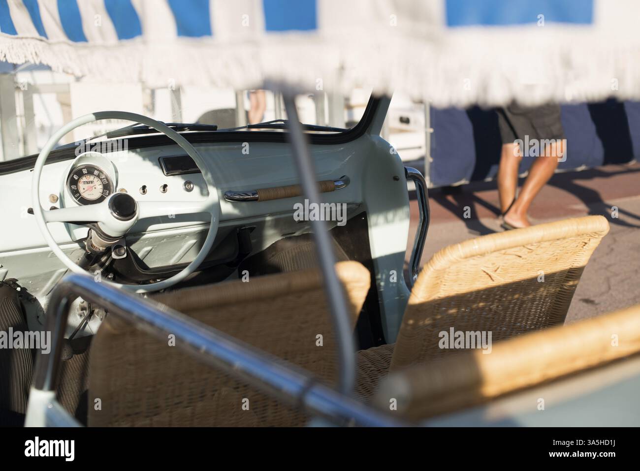 Vintage small blue car on sunlight Stock Photo - Alamy