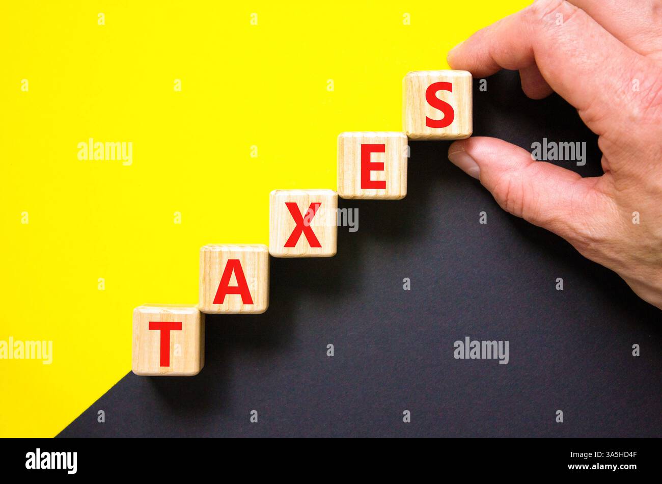 Taxes symbol. Concept word Taxes on beautiful wooden blocks. Beautiful ...