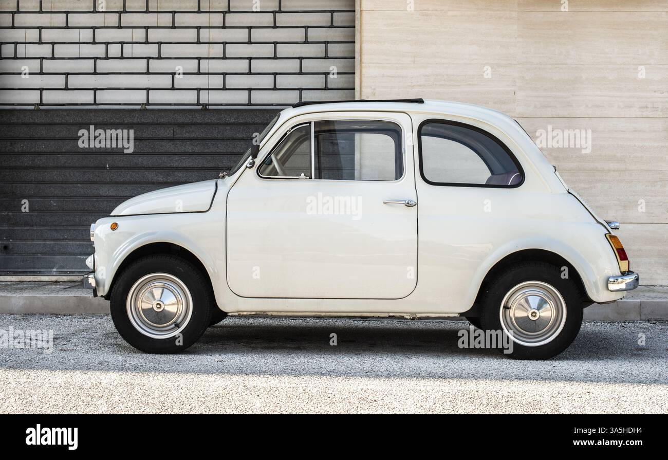 Small italian vintage car. White car Stock Photo - Alamy