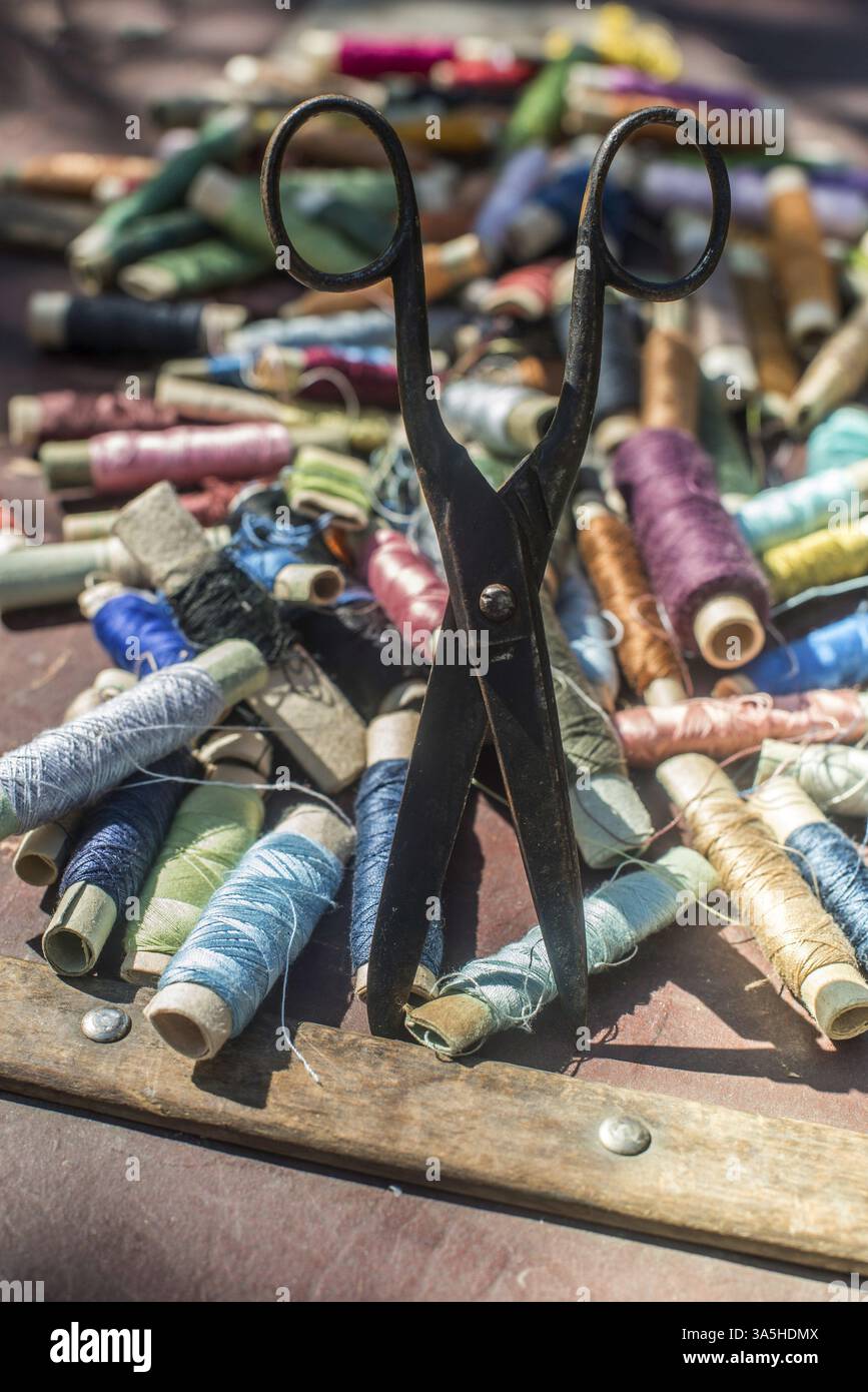 Vintage sewing thread and scissors Stock Photo - Alamy
