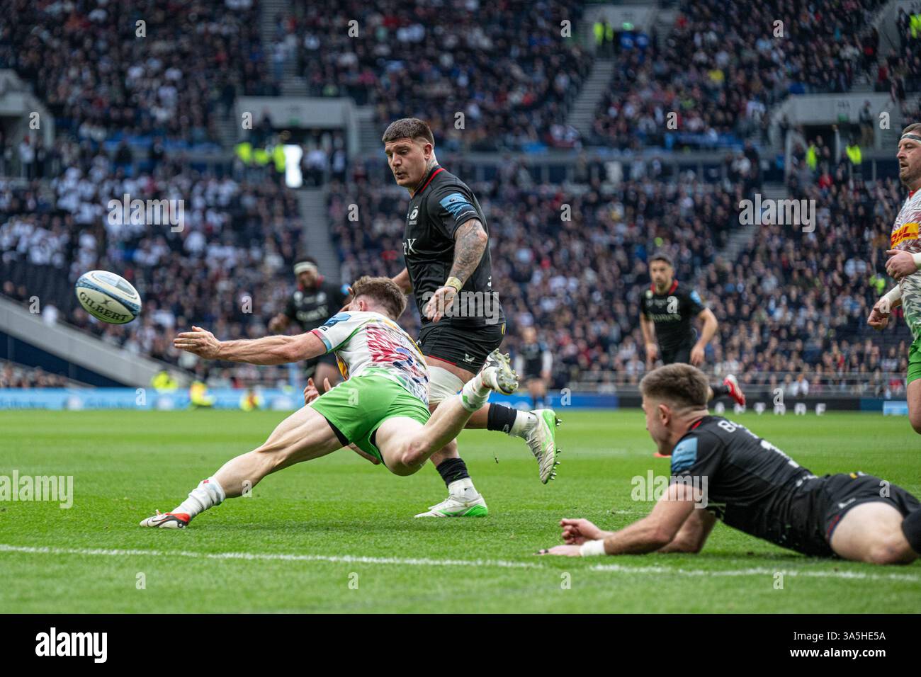London, UK. 22nd Mar, 2025. Jamie Benson of Harlequins collects the ...