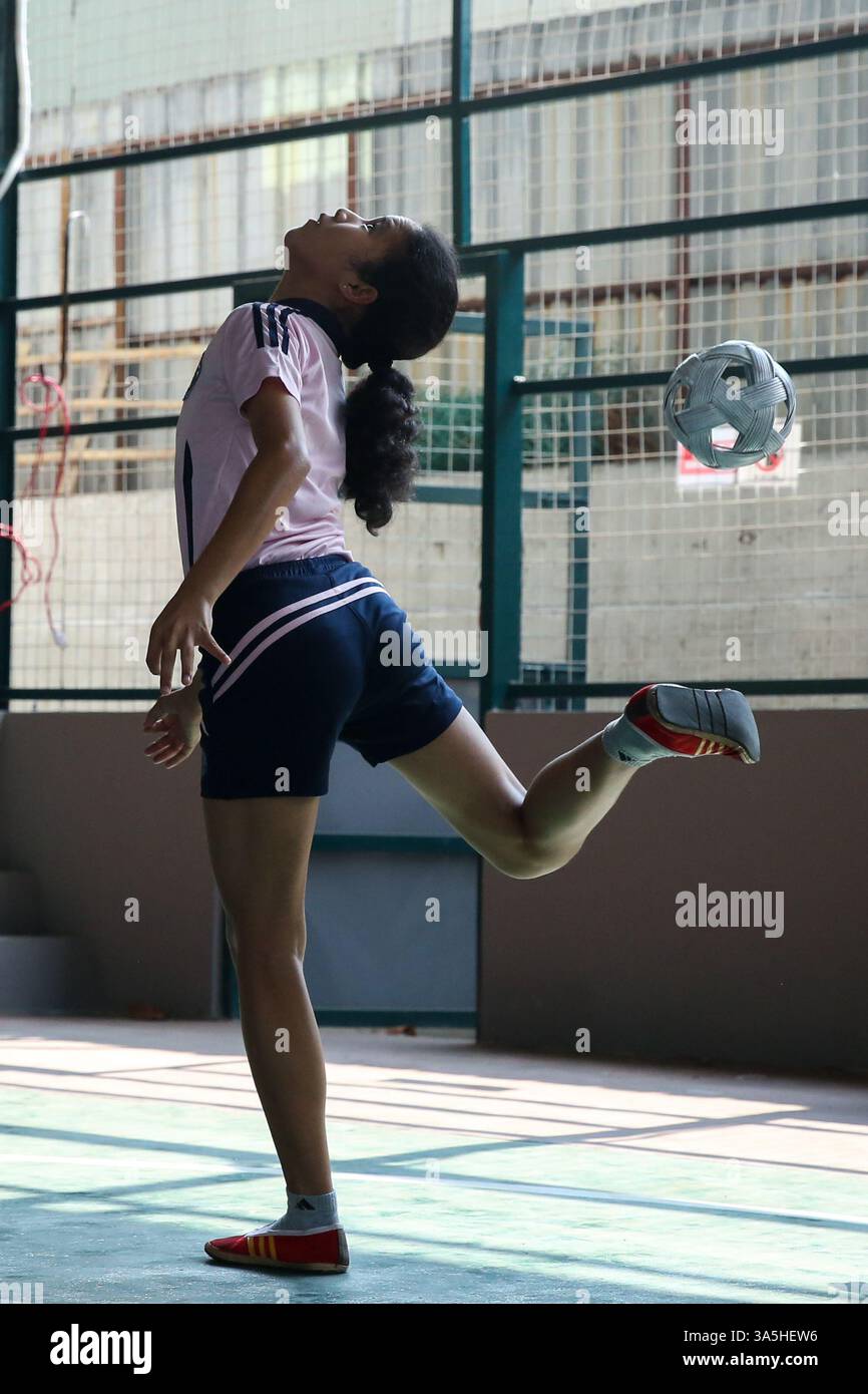 Yangon, Myanmar. 22nd Mar, 2025. A girl plays Chinlone (caneball) at an ...