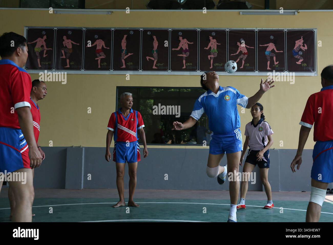 Yangon, Myanmar. 22nd Mar, 2025. People play Chinlone (caneball) at an ...