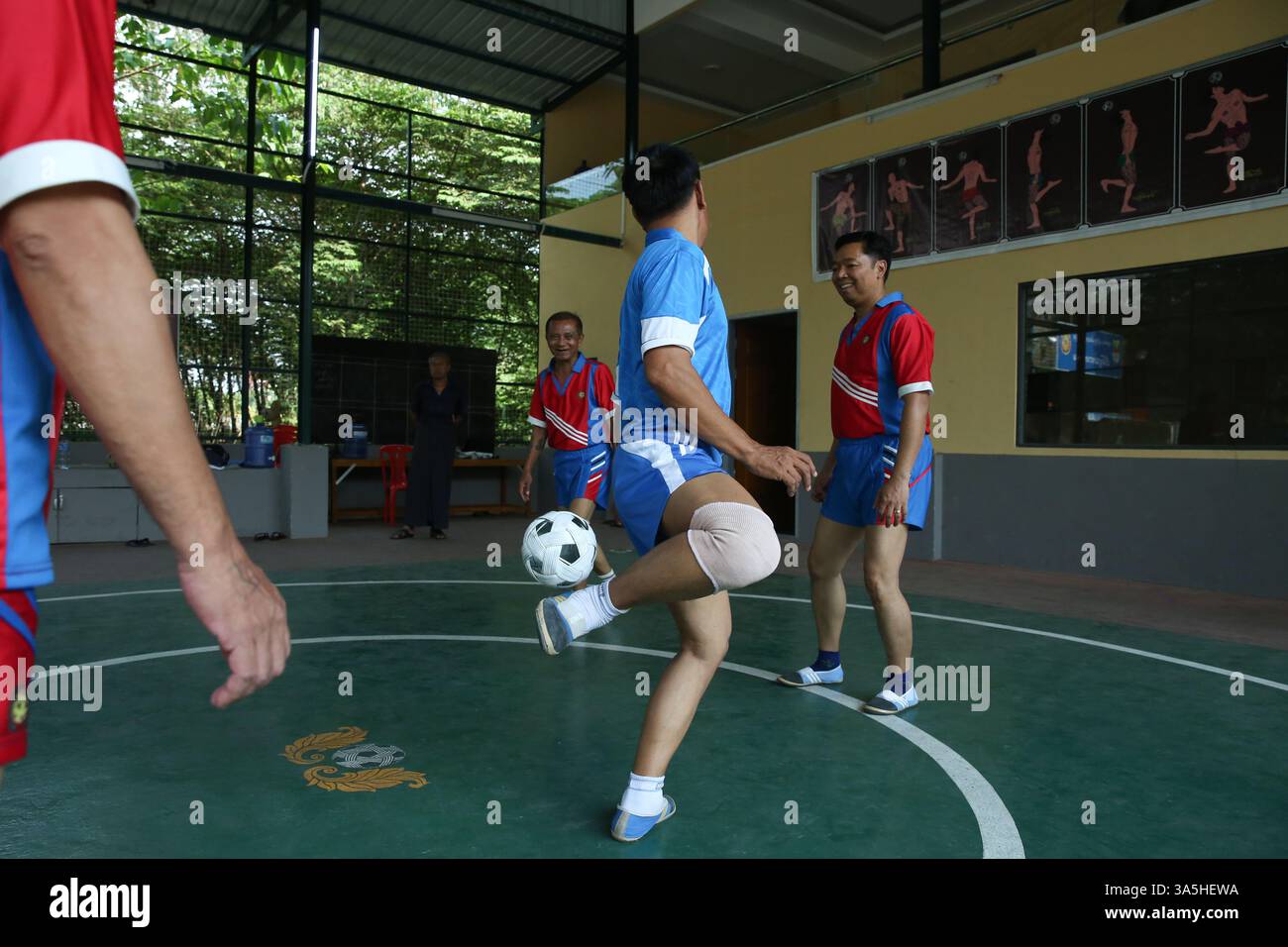 Yangon, Myanmar. 22nd Mar, 2025. People play Chinlone (caneball) at an ...