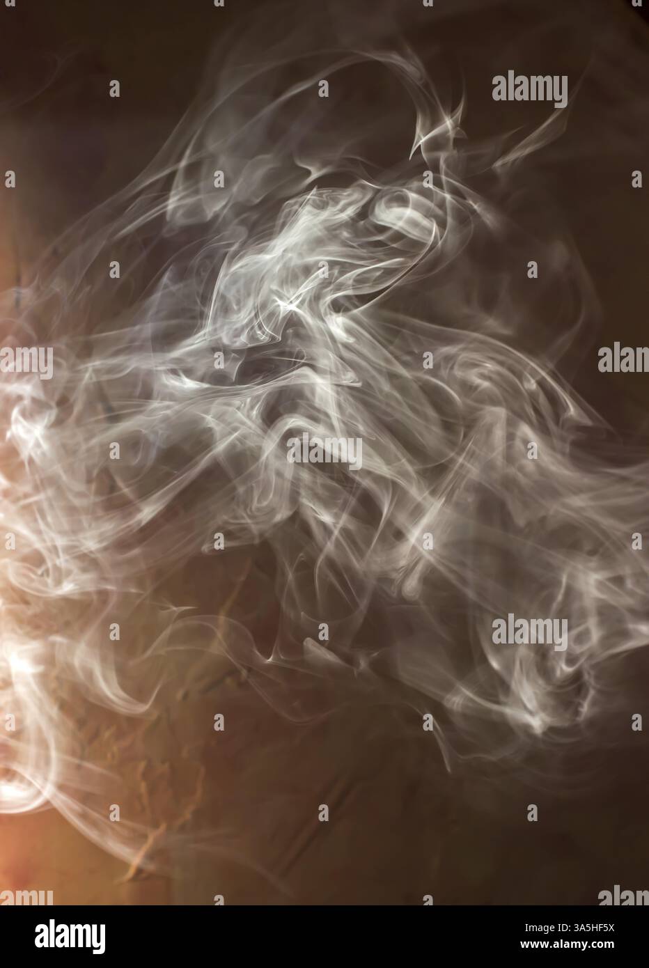 Smoke in room. Backlight from window Stock Photo - Alamy