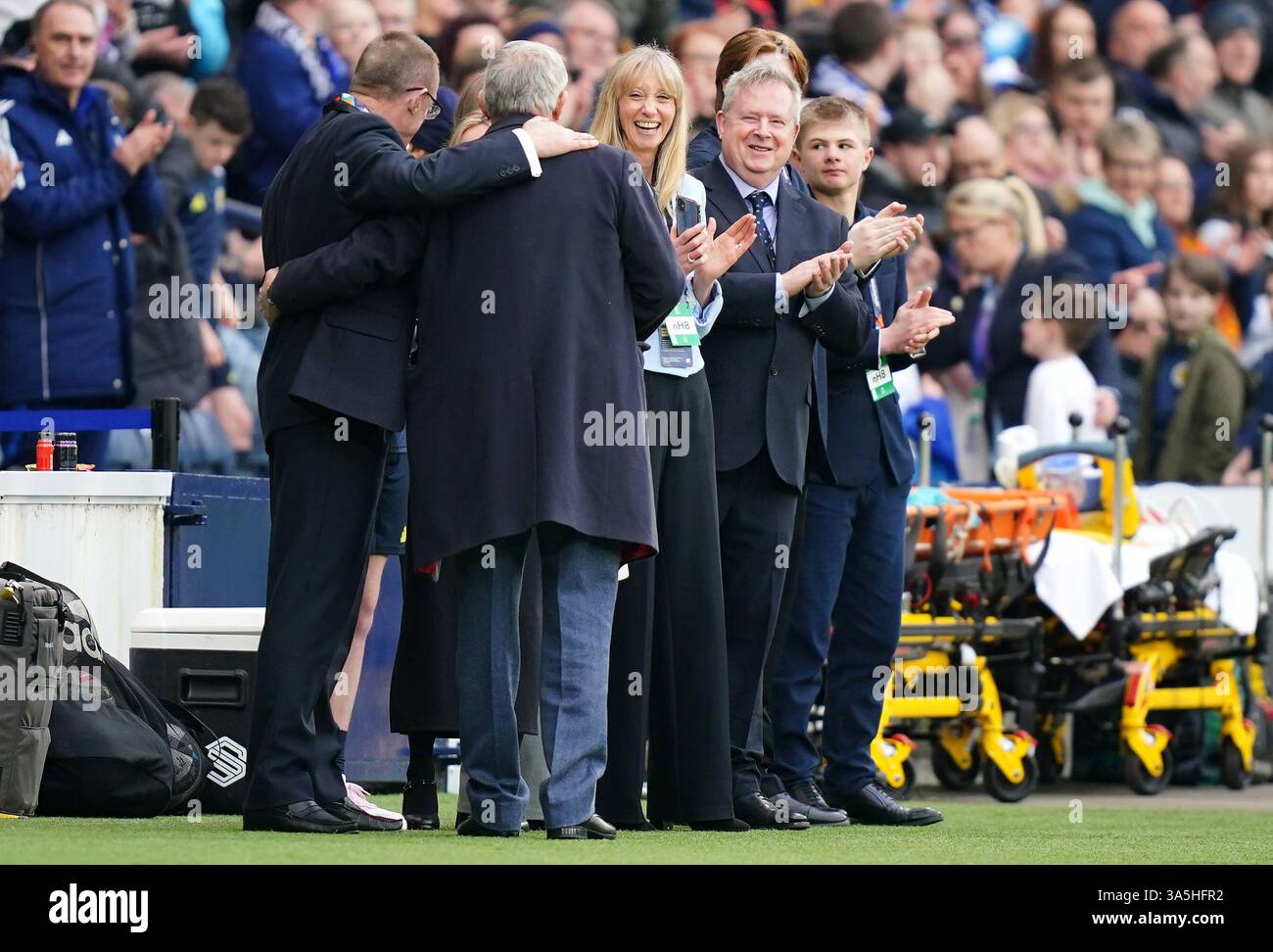 Sir Alex Ferguson with members of former Scotland player Denis Law's ...