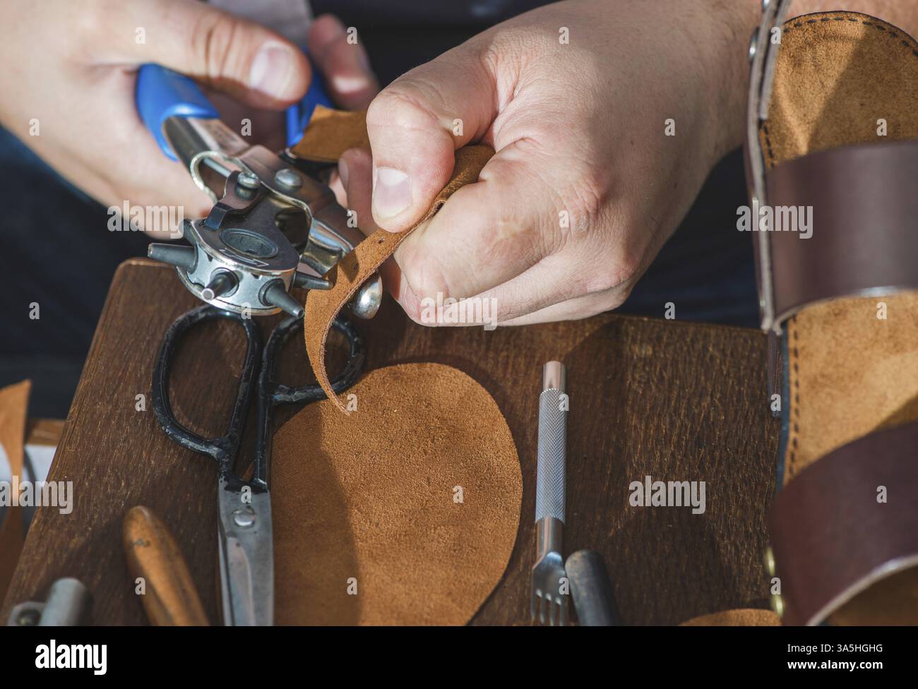 Making shoes manual. Leather sandals Stock Photo - Alamy