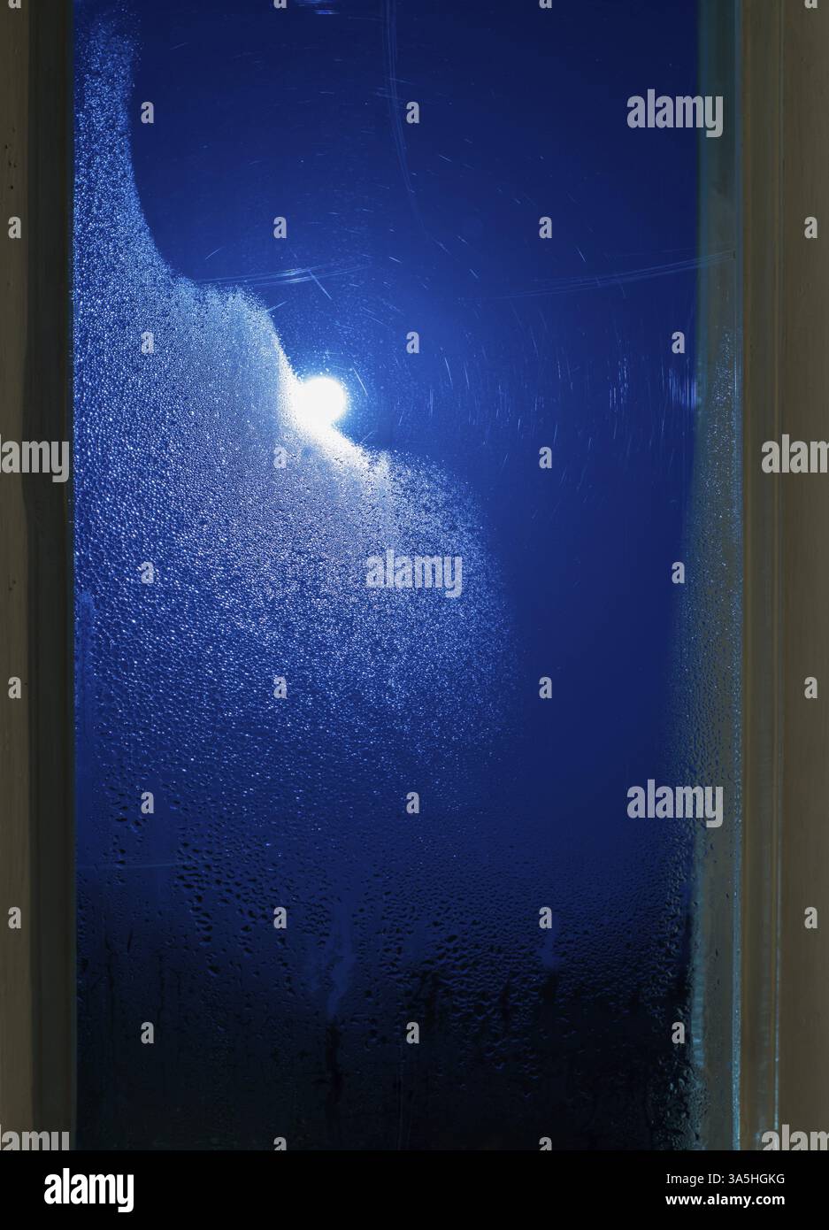 Moonlight through the window. Sweaty glass Stock Photo - Alamy