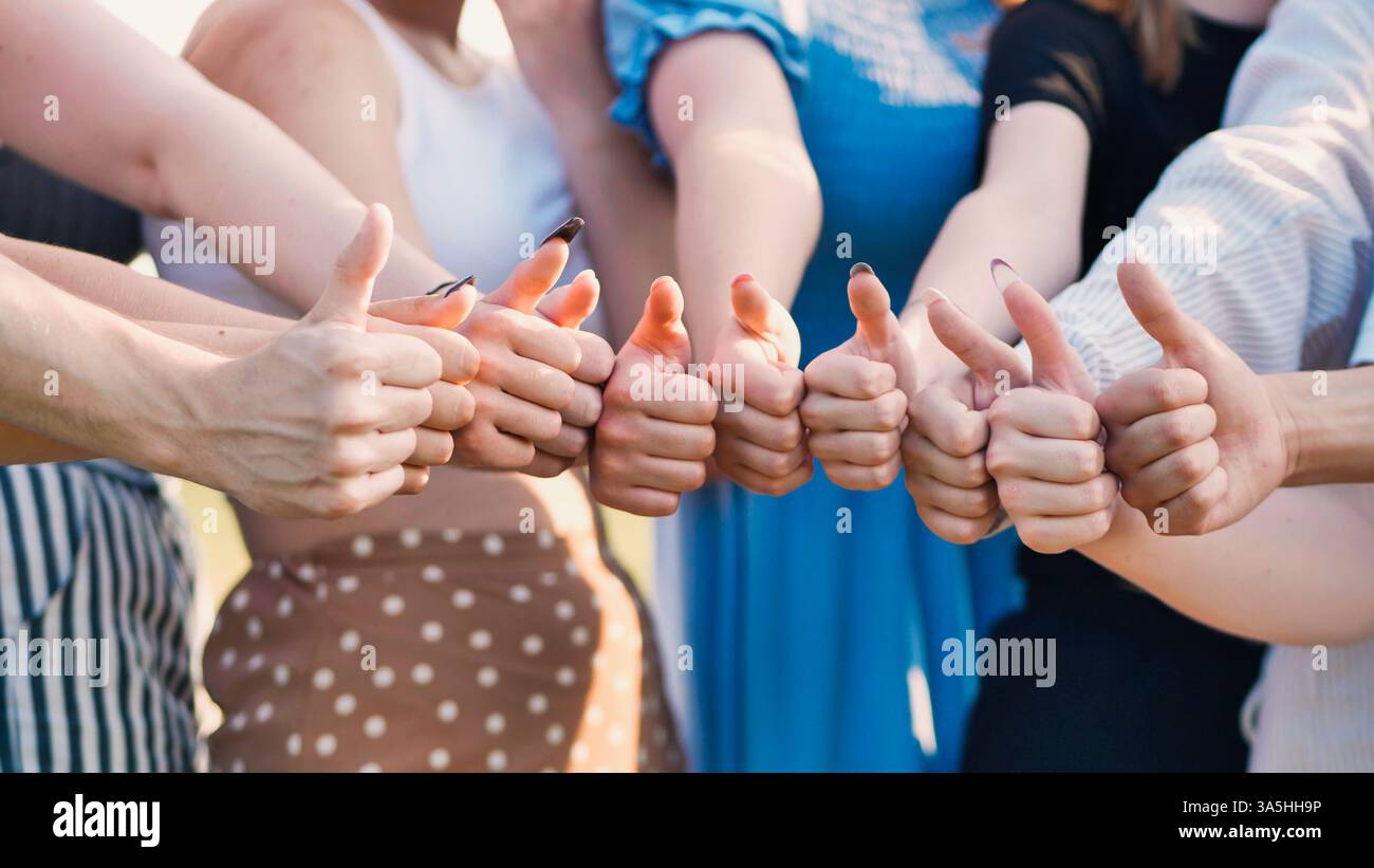 School friends celebrating their agreement and success with smiles and ...