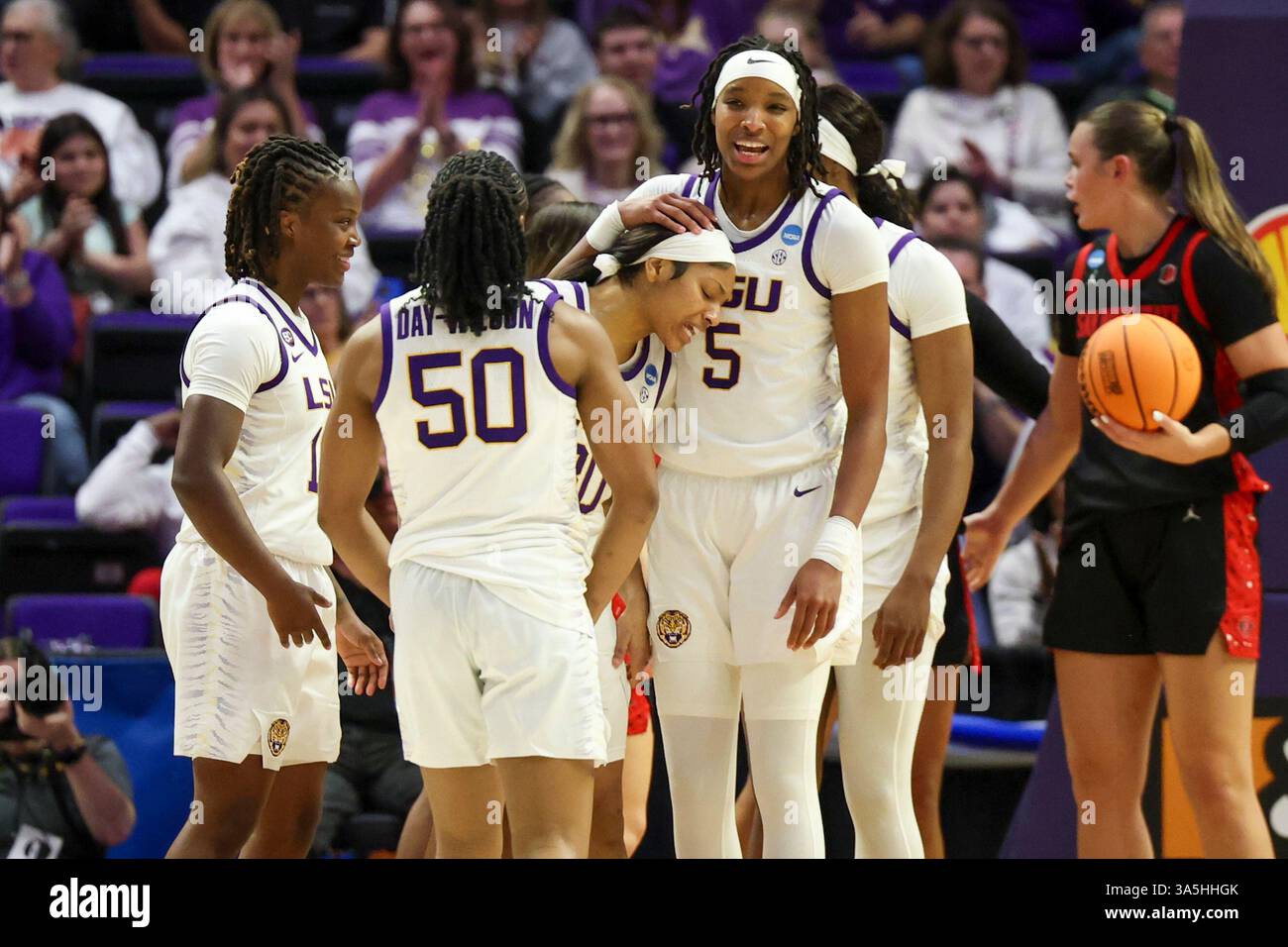 LSU Lady Tigers forward Sa'Myah Smith (5) reacts after guard Jada Richard (30) draws a foul ...