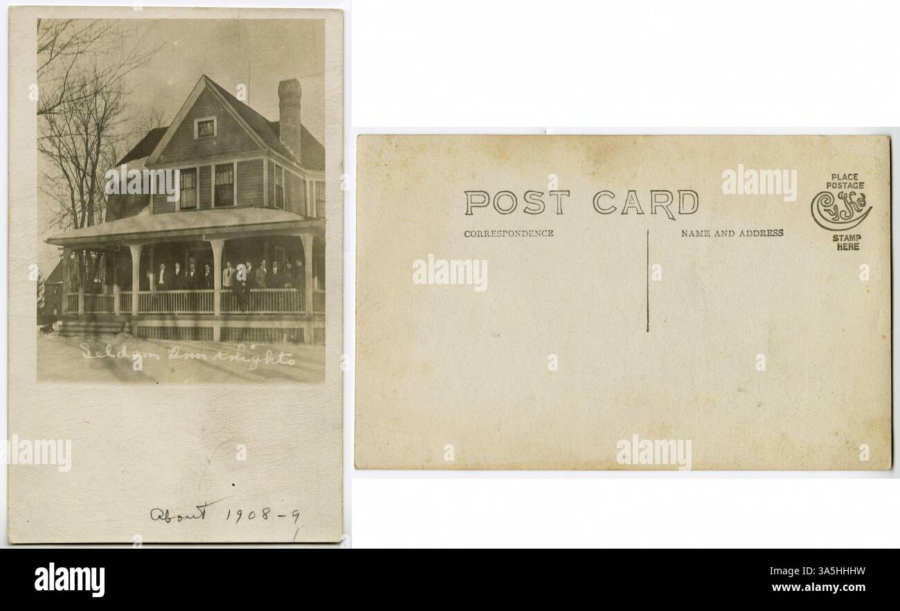 A group of male students pose for a photograph on the porch of the ...