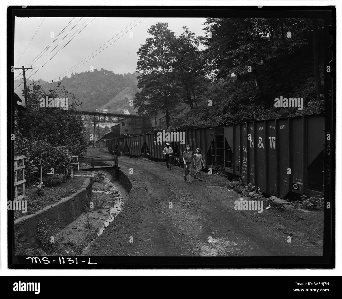 A street scene depicting company housing for miners in the Kingston ...