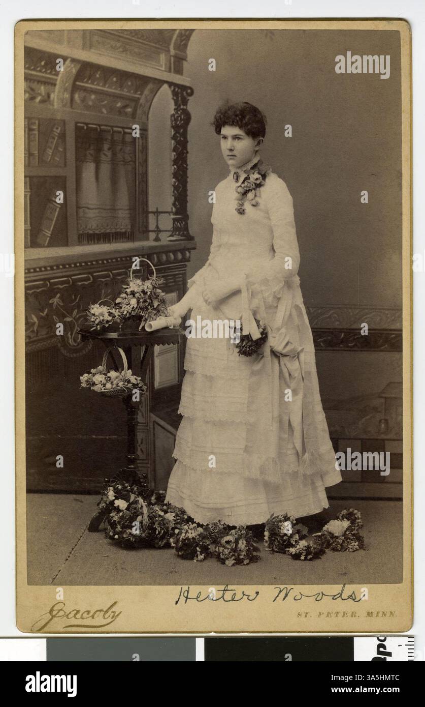This photograph shows Hester Woods of St. Peter holding a document in ...