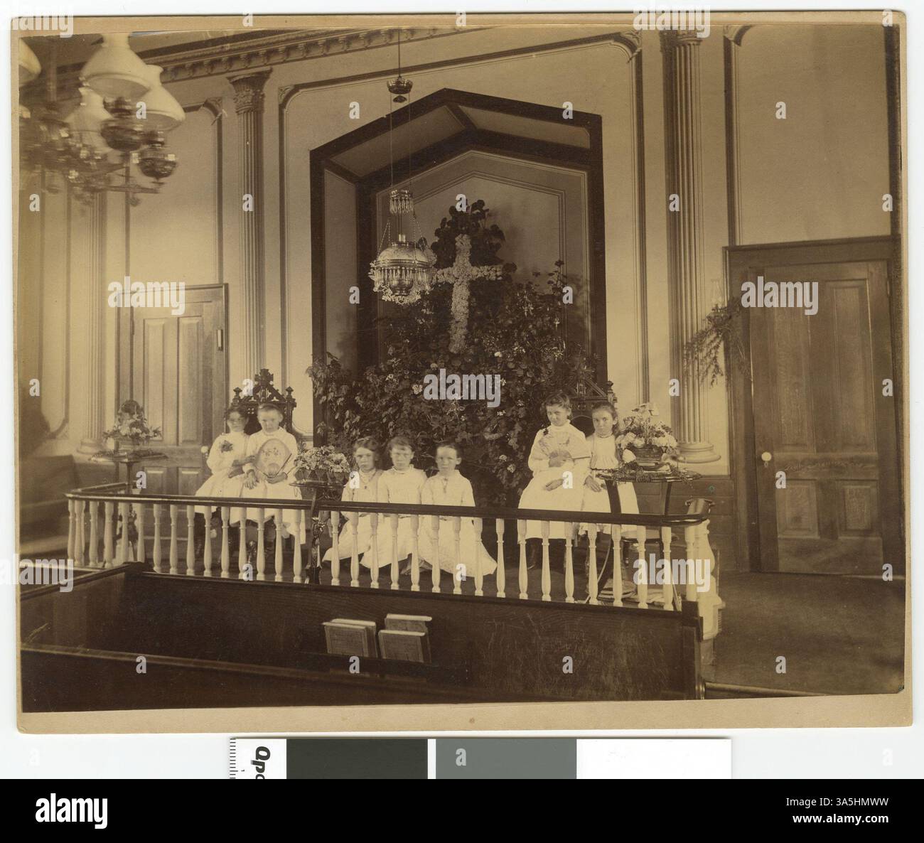 This photograph shows several children at the altar of the Methodist ...