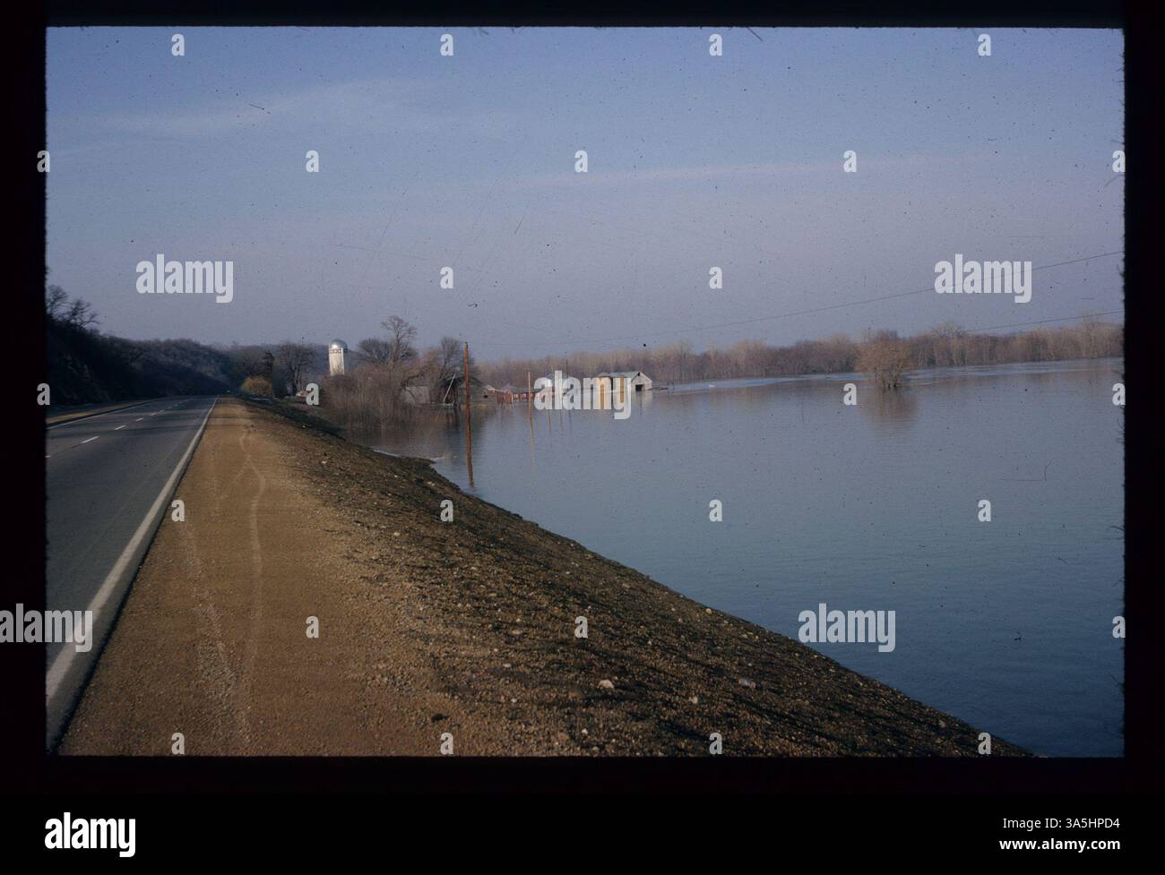 This 1965 photograph shows a flooded farm along Highway 169, between ...