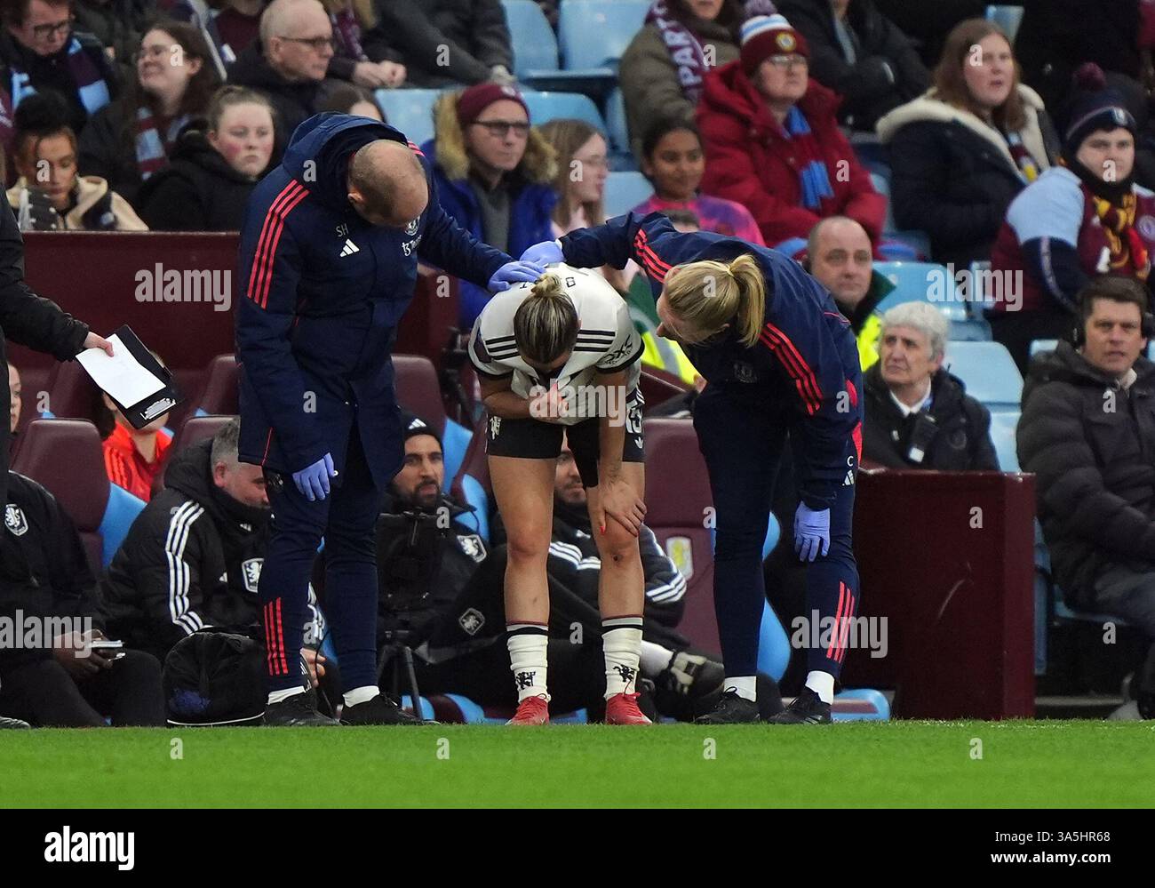 Manchester United's Celin Bizet Ildhusoy picks up an injury during the ...