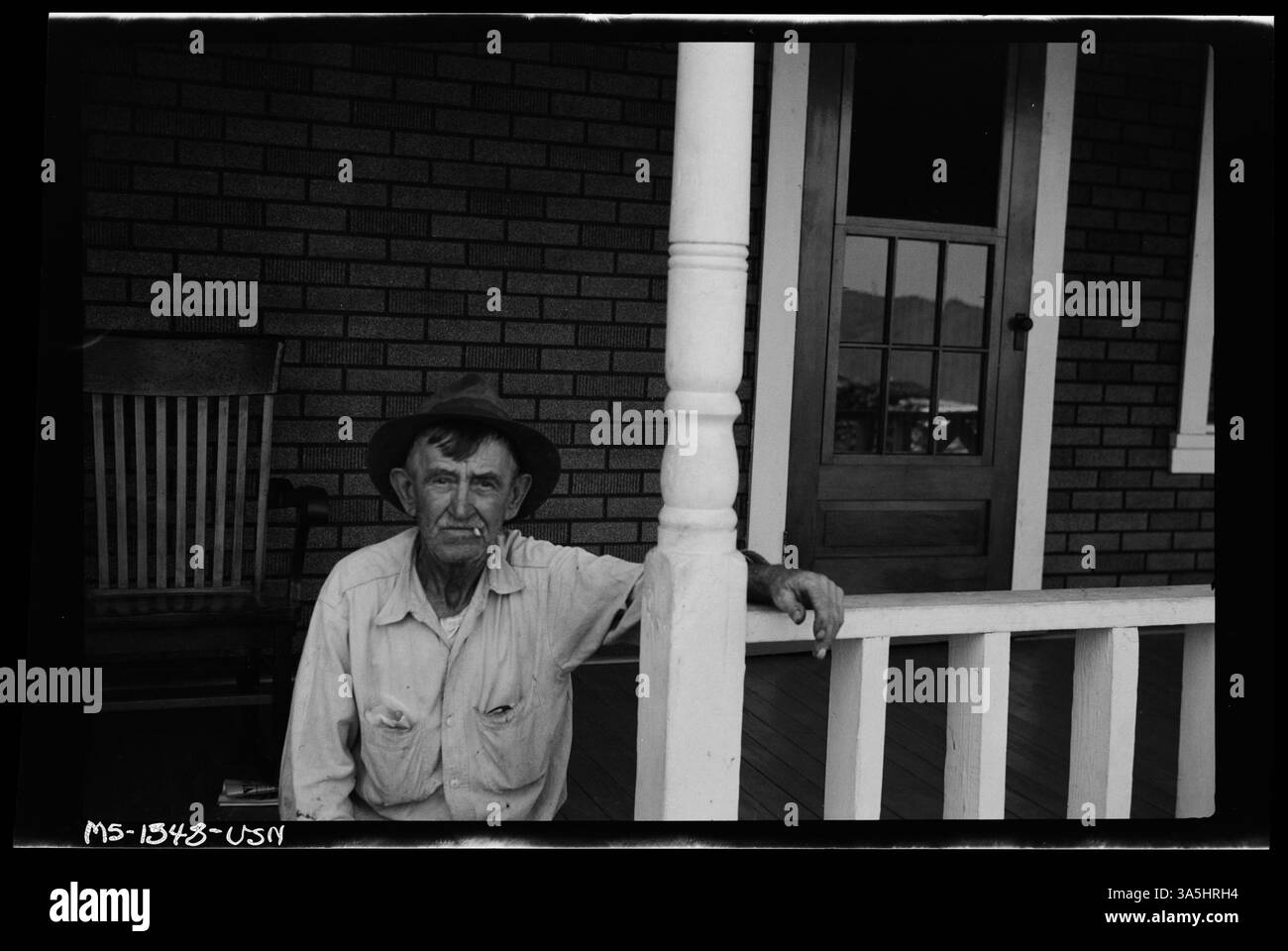 This 1946 photograph shows the owner of a house converted from a mule ...
