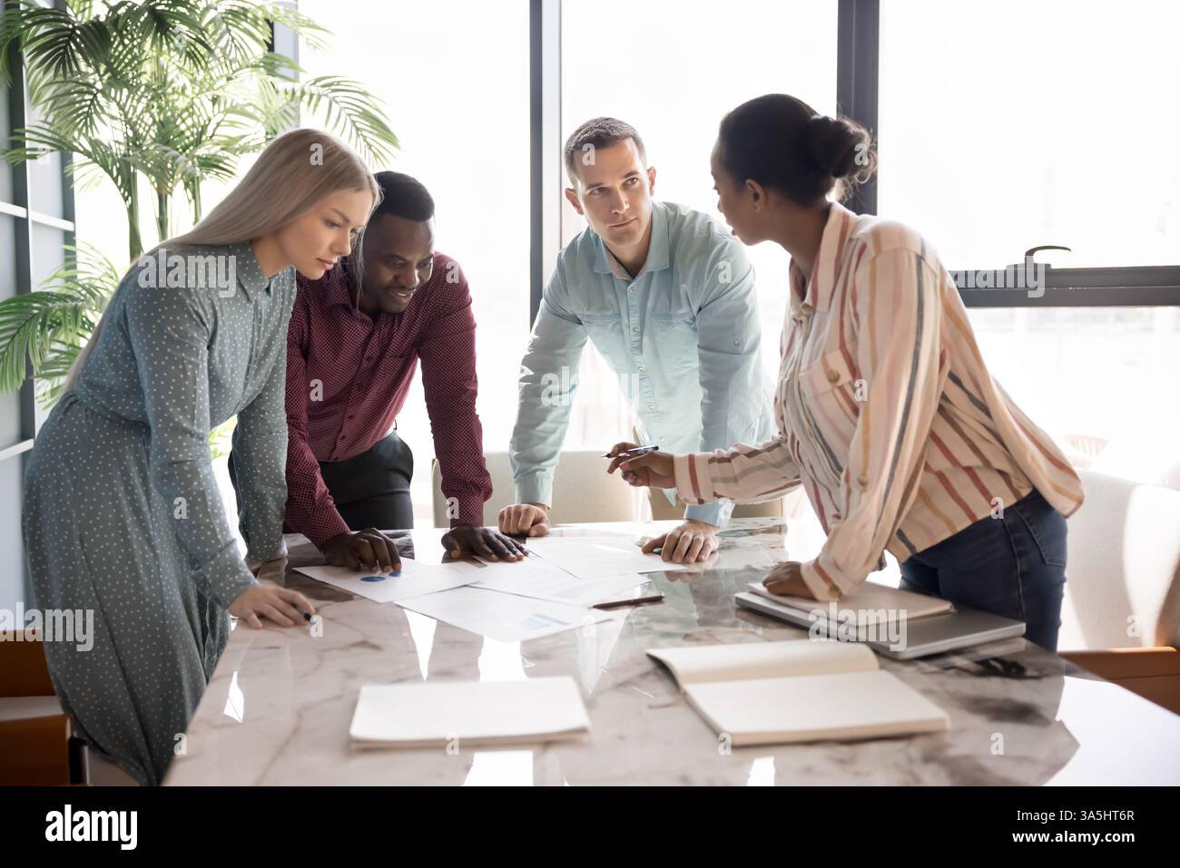 Business team reviewing diagrams in hi-res stock photography and images ...