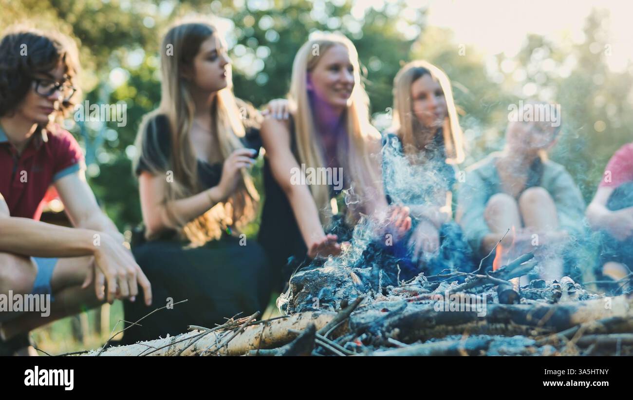 Teenage friends sitting fire hi-res stock photography and images - Alamy