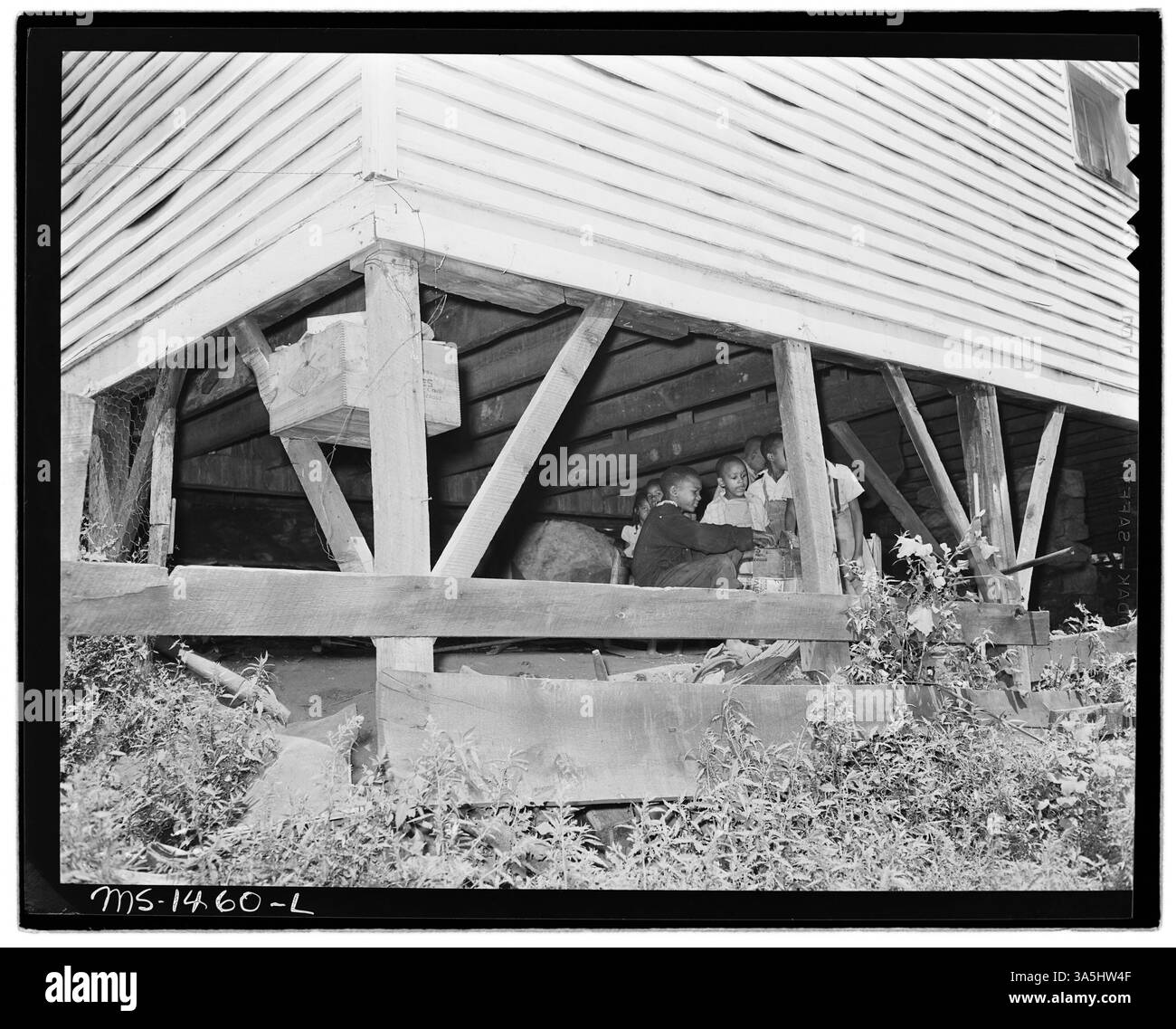 This image shows children playing under the house where the James ...