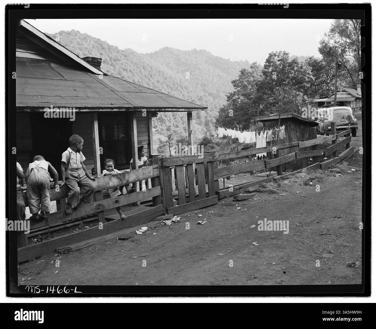 Children from neighboring families play outside the Howard home in ...