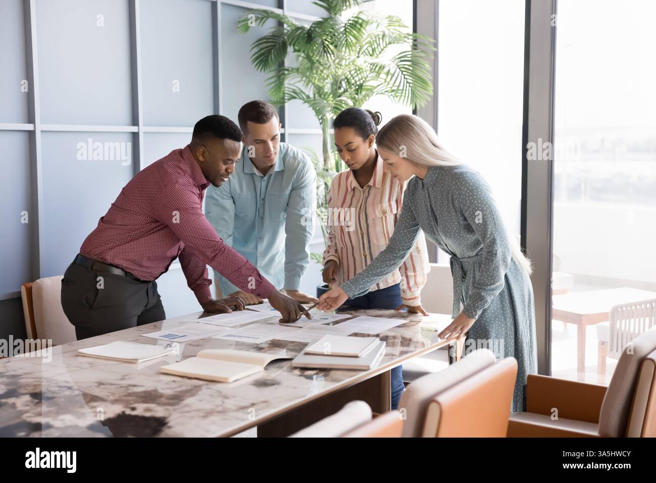 Reviewing sales data professionals hi-res stock photography and images ...