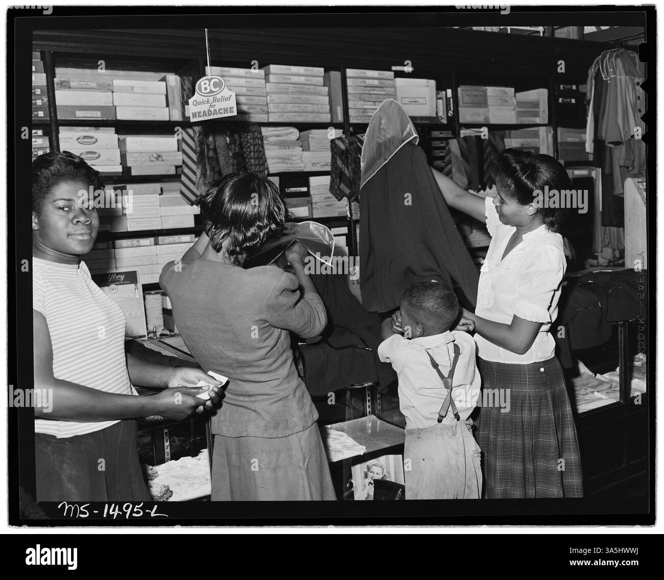 Mrs. James Robert Howard and her son are pictured inside the company ...