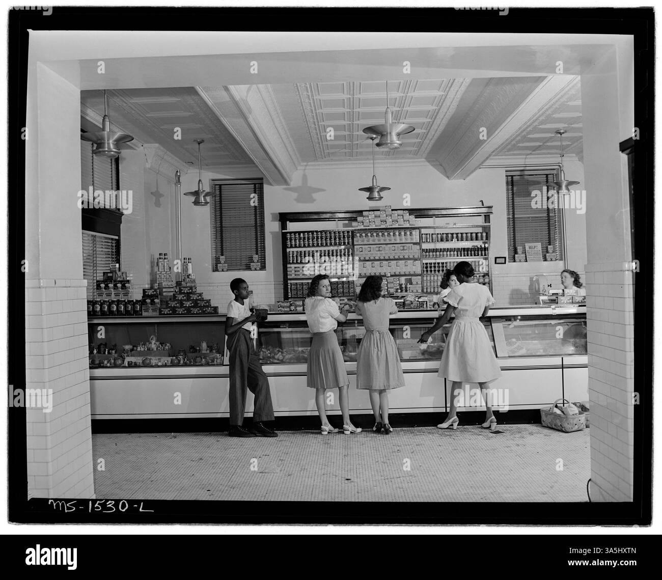 This 1960s photograph shows the meat counter in the subsidiary company ...