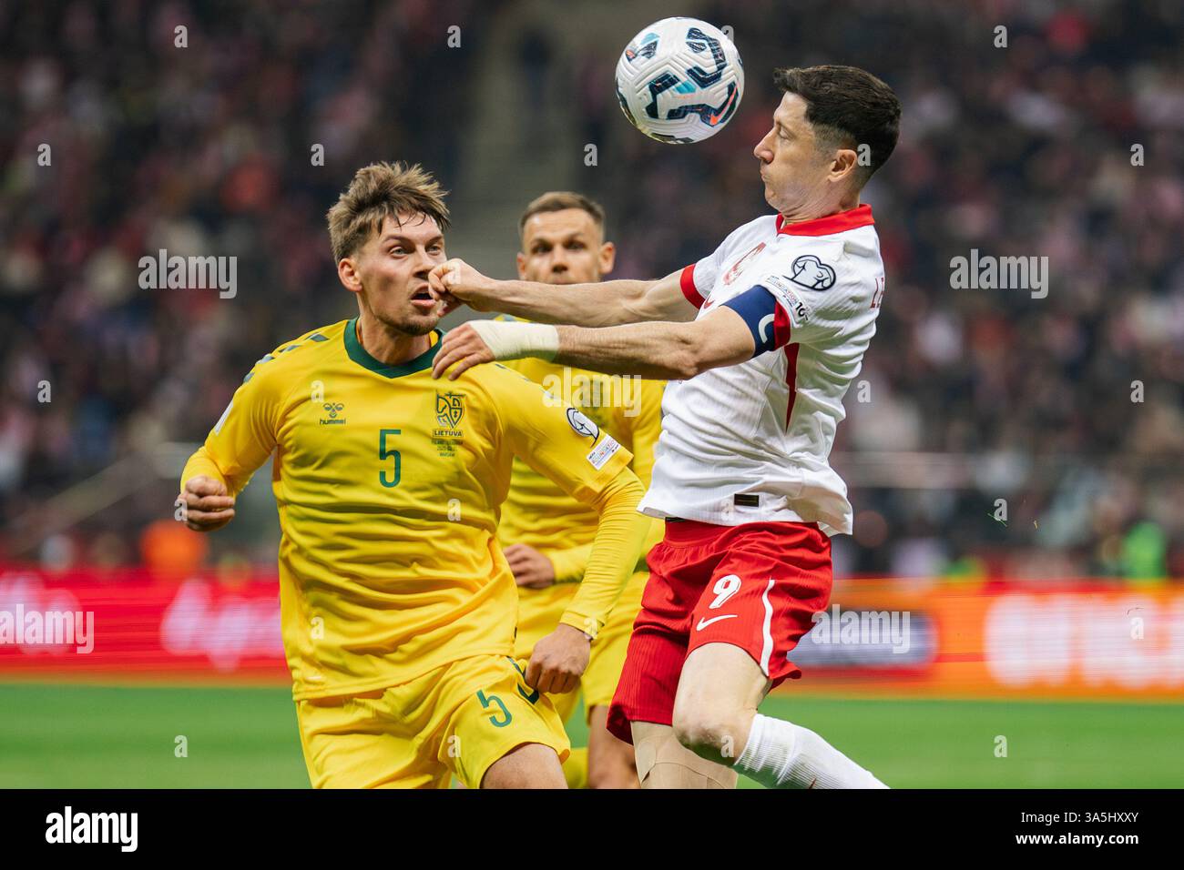 Kipras Kazukolovas (L) of Lithuania and Robert Lewandowski (R) of ...