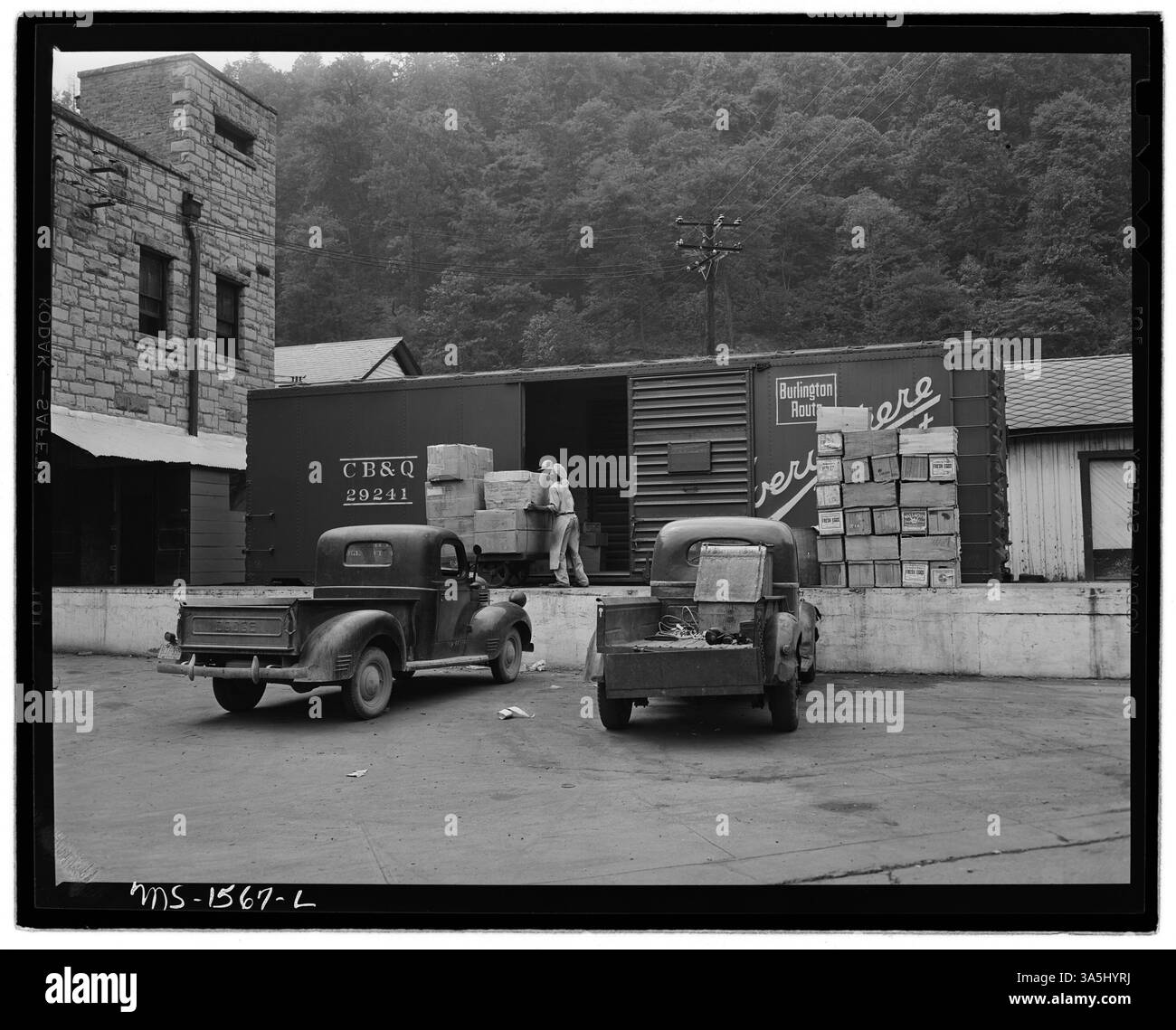 This photograph shows the unloading of groceries at the company store ...